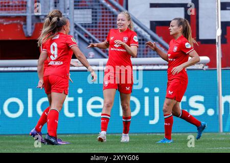 ENSCHEDE - Jaimy Ravensbergen of FC Twente (m) receives congratulations after scoring 3-2 during ...