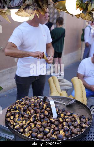 Roasting chestnuts in a pan, South Italy Stock Photo - Alamy