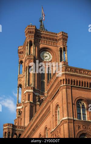 Brick building with decorative turrets in front of a modern building ...