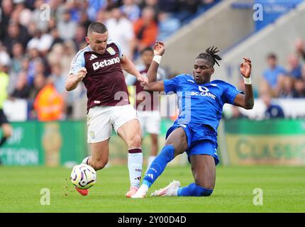 John McGinn of Aston Villa is tackled by Ao Tanaka of Leeds United ...