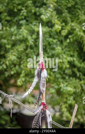 Native american indian spearhead with feathers and red ribbon Stock ...