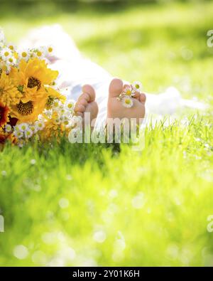 bare feet on spring grass and flowers Stock Photo - Alamy