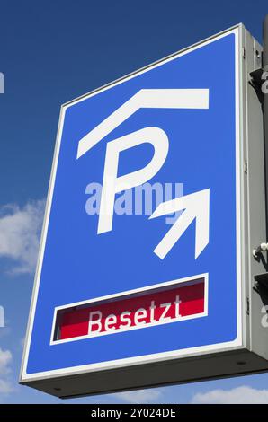 Signboard for parking garage shows occupied. Signboard for parking ...