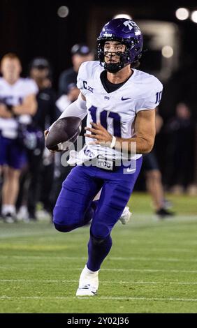 TCU quarterback Josh Hoover (10) rolls out to throw a pass during an ...