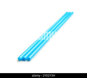 Blue plastic straws on white background Stock Photo - Alamy