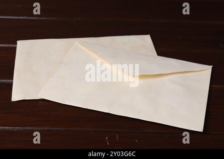 Envelopes on wooden table, closeup. Mail service Stock Photo - Alamy
