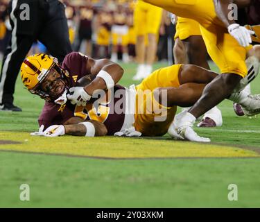 Arizona State running back DeCarlos Brooks, left, leaps into the end ...