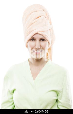 nice woman with towel on head putting cream Stock Photo - Alamy