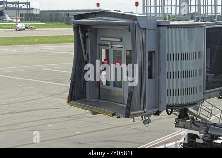 Movable skybridge passenger boarding bridge at airport Stock Photo - Alamy