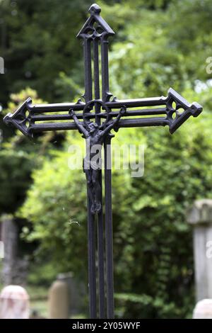 Grave cross with crucified man Stock Photo - Alamy