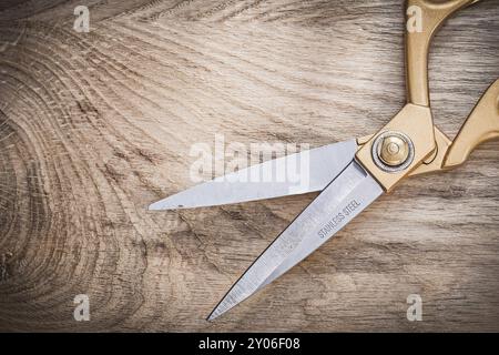 Pair of vintage golden scissors on wooden board copy space Stock Photo ...