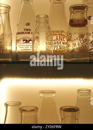 Selection of vintage glass milk bottles bearing name or names of dairy ...