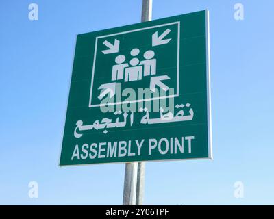 Assembly Point Sign in Arabic and English languages that uses safety ...