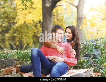 Happy couple enjoying golden autumn spring season in the park Stock ...