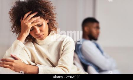 Frustrated afro couple having misunderstanding in relationship ...