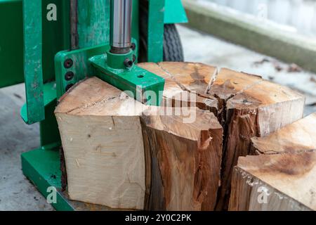 Hydraulic wood chopper splitting a big tree stump Stock Photo - Alamy