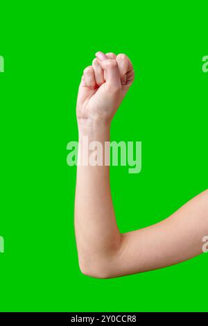 Woman's Arm With Fist Raised Against Green Screen Stock Photo - Alamy