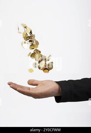 Businessman tossing Euro coins Stock Photo - Alamy