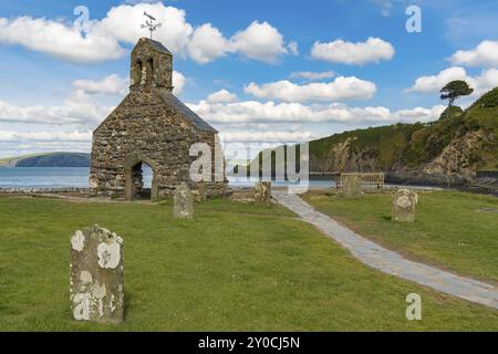Old church and gravestones at Cwm Yr Eglwys in the Pembrokeshire coast ...