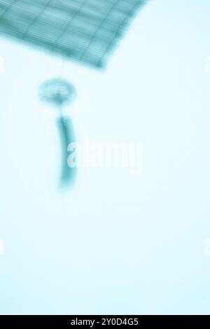 Bamboo blind and the shadow of a wind chime Stock Photo - Alamy