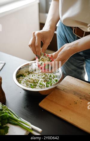 Woman hands hold bell pepper on blue background Stock Photo - Alamy