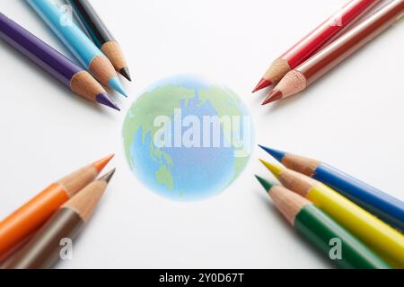 Colored pencils surrounding the Earth Stock Photo - Alamy