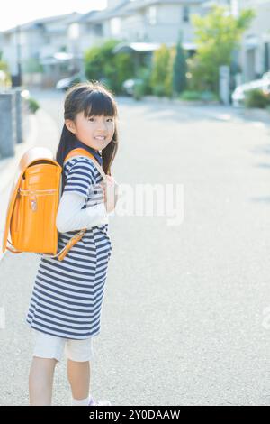 school child with school bag or school satchel on the back school child ...