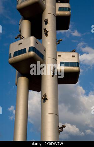 Sculptures of babies crawl on the supports of the Television Tower in ...