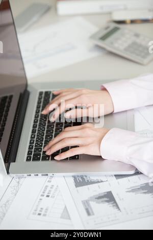 A young business lady hitting computer keyboard Stock Photo - Alamy