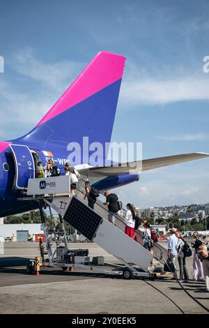 Nice, France - August 5, 2024: Wizz Air aircraft boarding passengers at ...