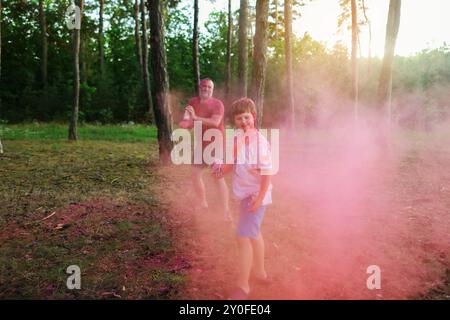 Father and son at Holi paint party. Family make funny party Stock Photo ...