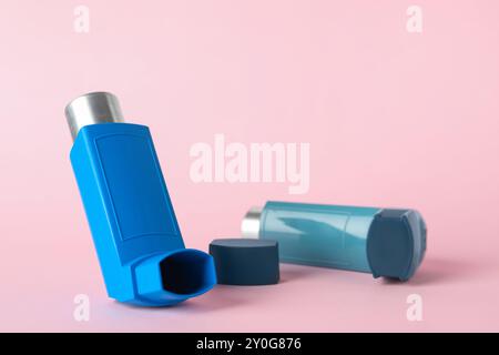 Inhalers on pink background, closeup. Asthma treatment Stock Photo - Alamy