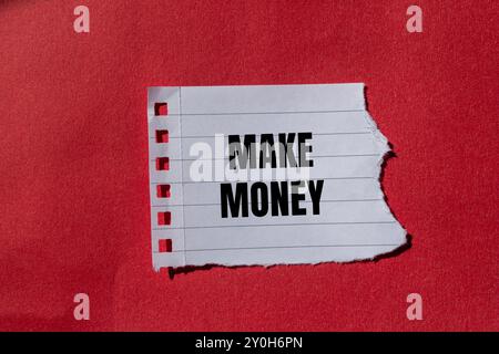Make money message written on ripped torn blue paper with red ...
