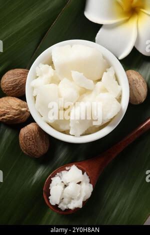 Shea butter in bowl and spoon on wooden board, close up Stock Photo - Alamy