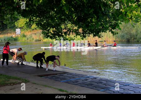 Coxed eight shell scull (eight-man crew with single oars) cox. River ...