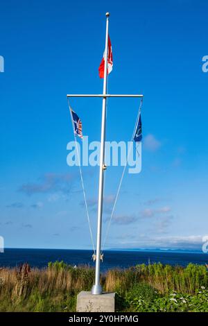 Flags flying at Green Point Lighthouse in Port de Grave, Newfoundland ...