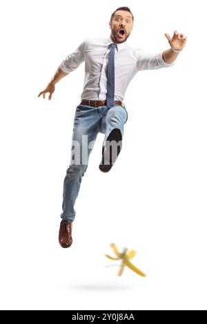 A view of a shocked young businessman isolated on white background ...