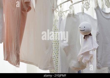 Indoor drying laundry and a paper doll Stock Photo - Alamy