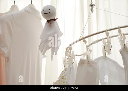Indoor drying laundry and a paper doll Stock Photo - Alamy