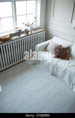 Objects placed at the window and sofa Stock Photo - Alamy