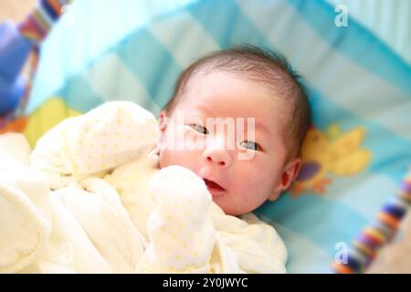 Smiling baby of three weeks after birth Stock Photo - Alamy