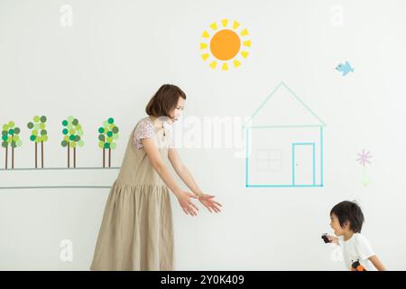 Mother calling over child Stock Photo - Alamy