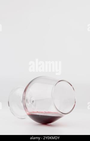 A broken glass and spilled wine on a tiled floor Stock Photo - Alamy