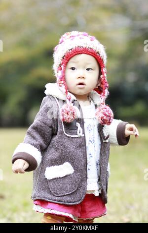 Baby girl in knitted hat and sweater. Postcard Mother's Day and Easter ...