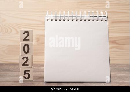 2025 mockup notepad. 2025 cubes wooden table background. New Year ...