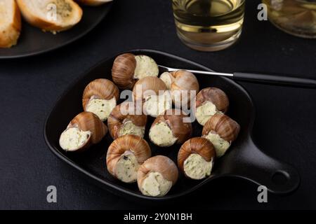French cuisine - Escargot with butter sauce Stock Photo - Alamy