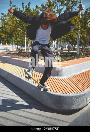 Image of a young sports guy outdoors on the beach with bicycle holding ...