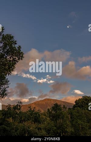 The almost full crescent moon rises over the Iguaque mountain, in the ...