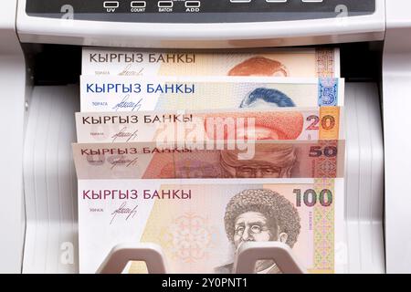 Old Kyrgyz money - som in the counting machine Stock Photo - Alamy