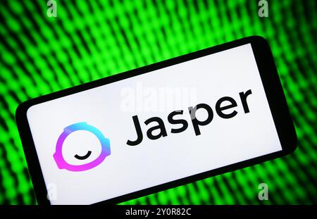 In this photo illustration, the Jasper AI logo is displayed on a ...